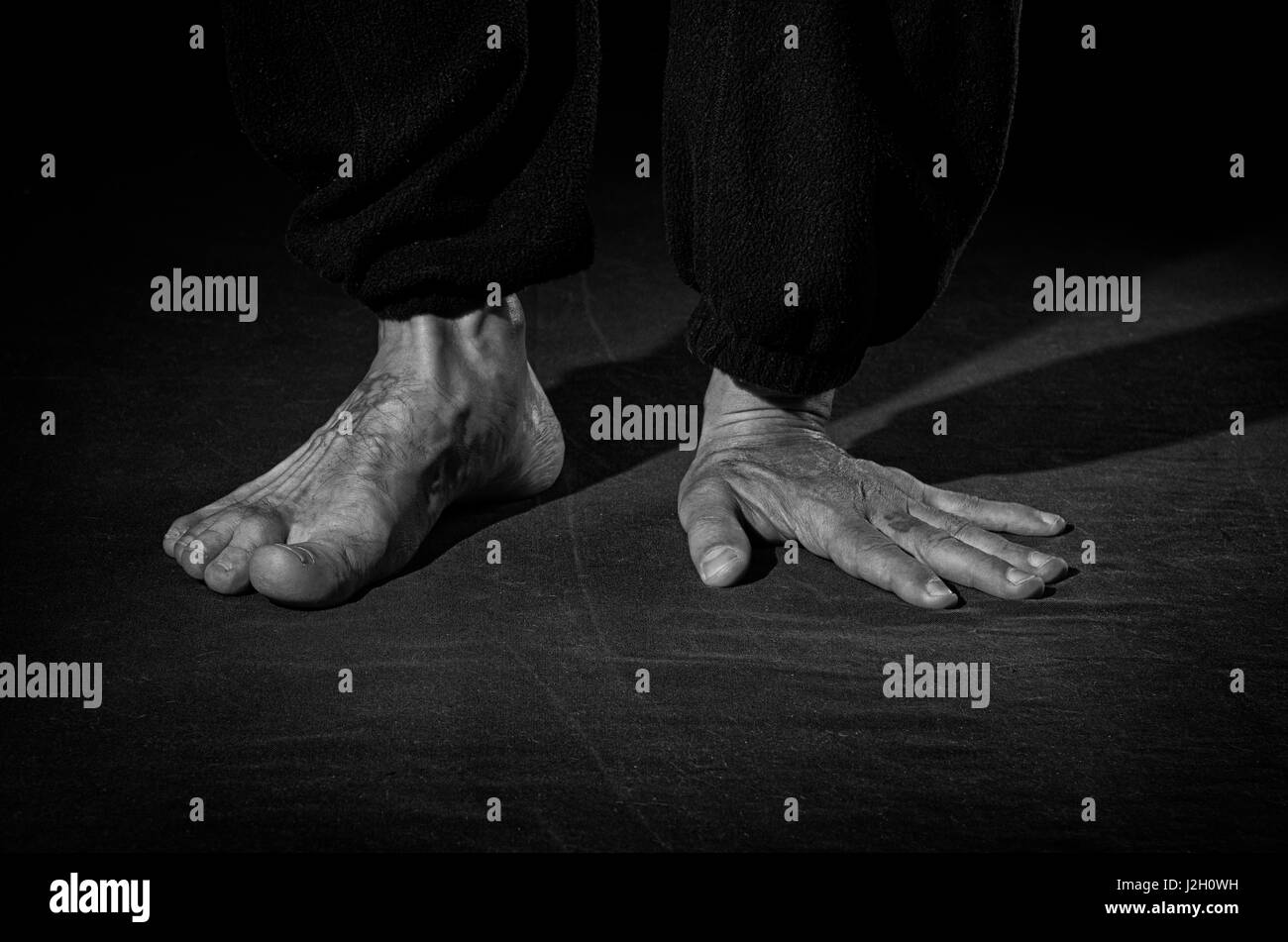 Standing on one leg Black and White Stock Photos & Images - Alamy