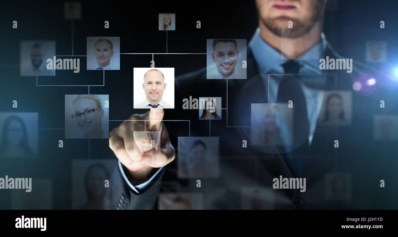 businessman touching virtual screen with contacts Stock Photo - Alamy