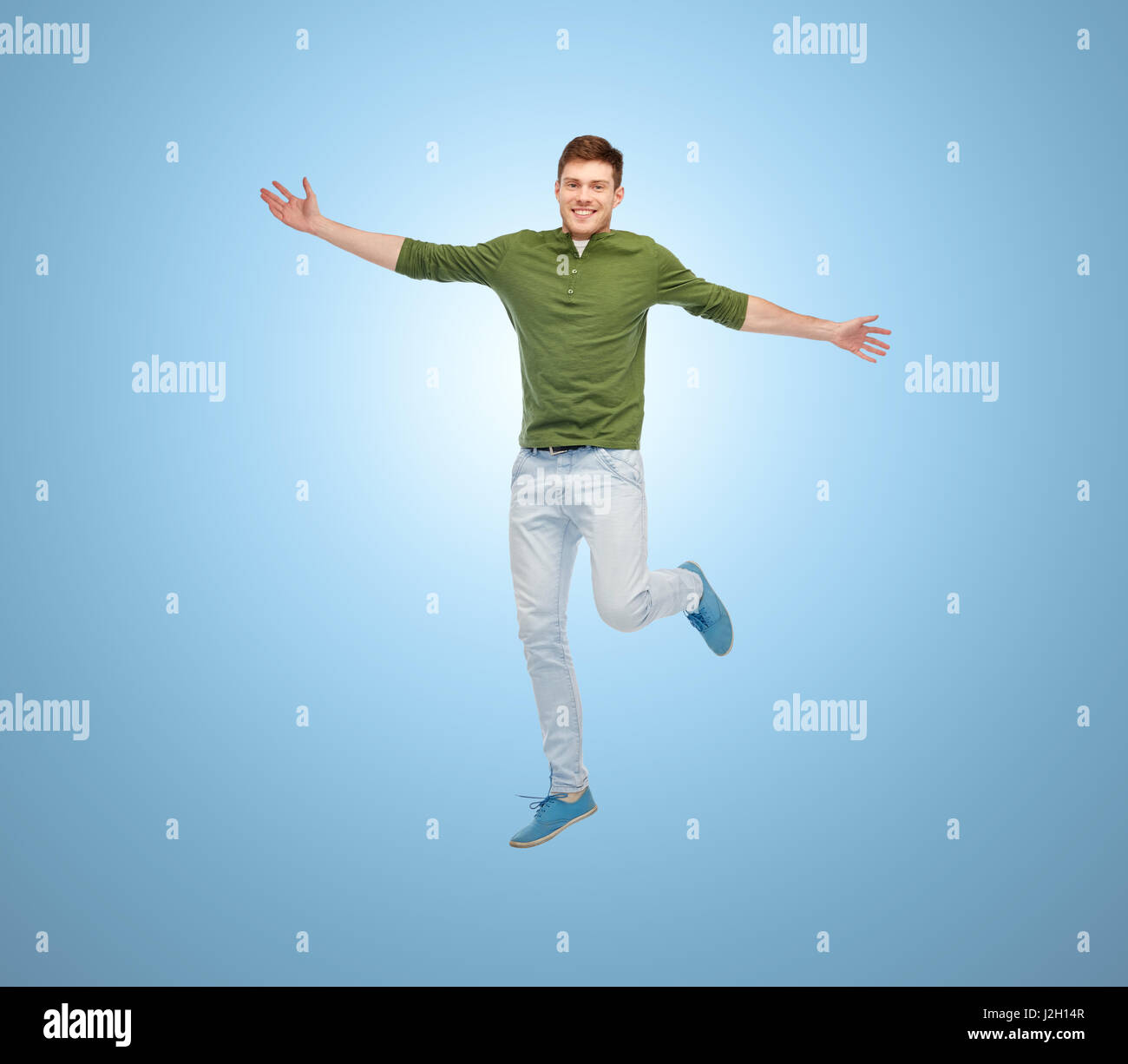 Smiling man jumping hi-res stock photography and images - Alamy
