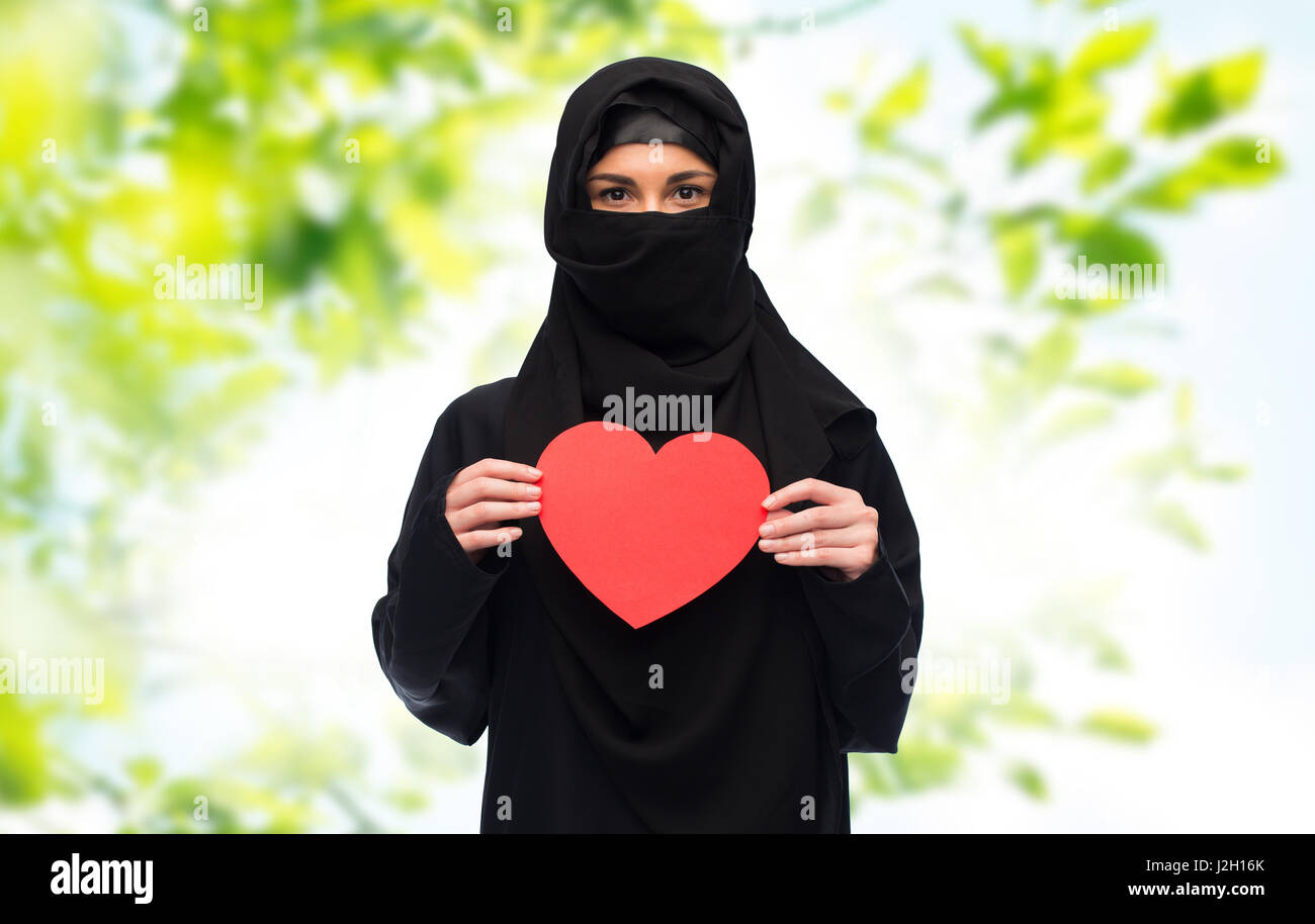 muslim woman in hijab holding red heart Stock Photo - Alamy