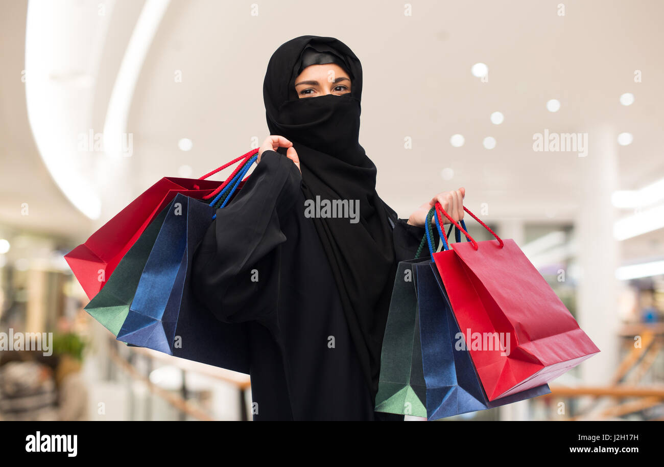 muslim woman in hijab with shopping bags Stock Photo - Alamy