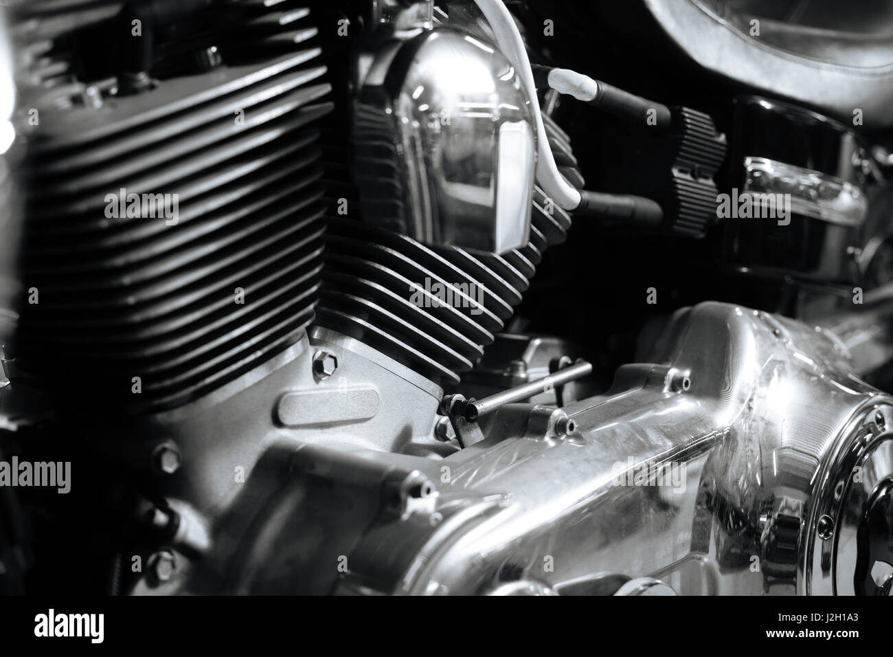 Old school motorcycle standing in garage Stock Photo - Alamy