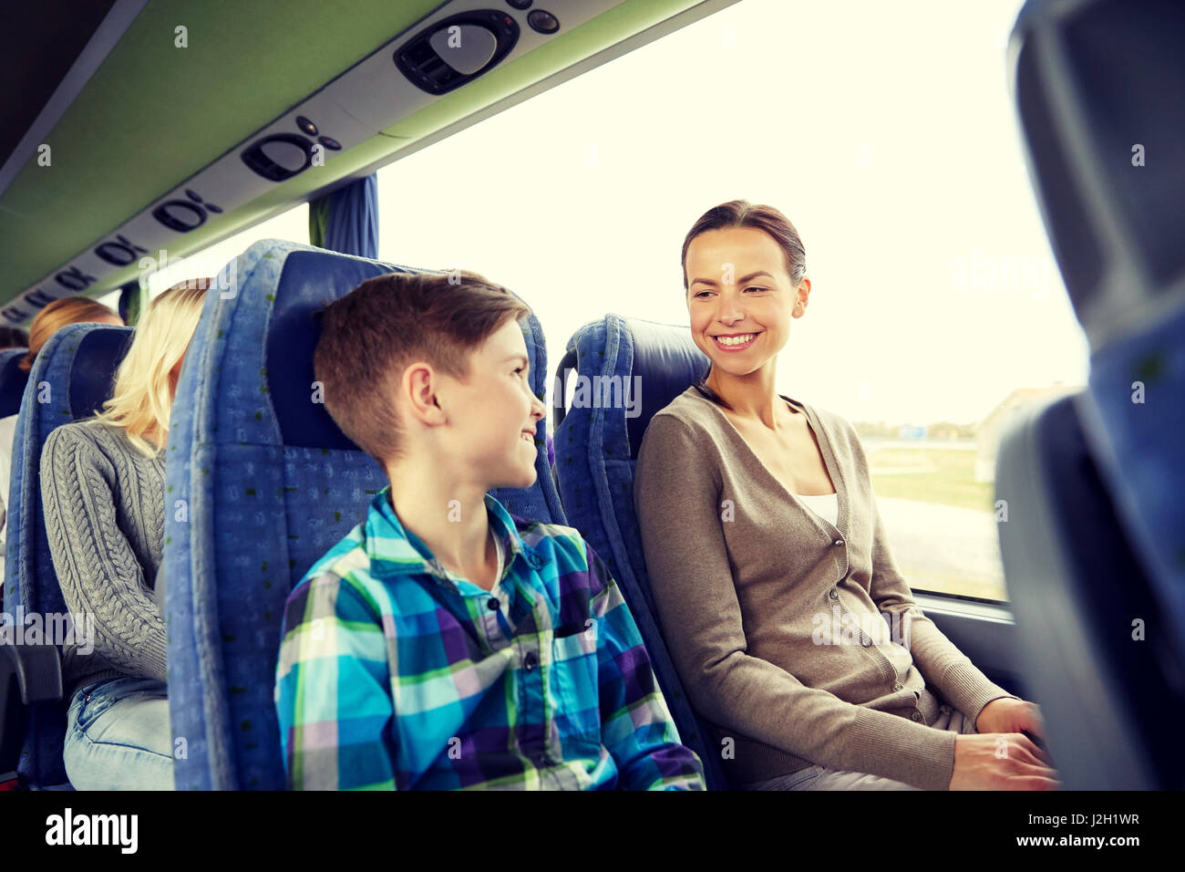 happy family riding in travel bus Stock Photo - Alamy