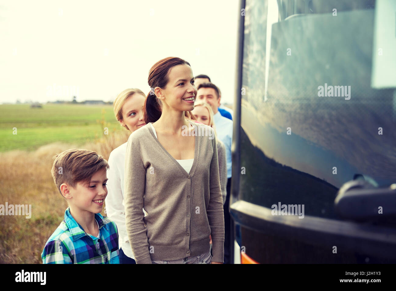 group of happy passengers boarding travel bus Stock Photo - Alamy