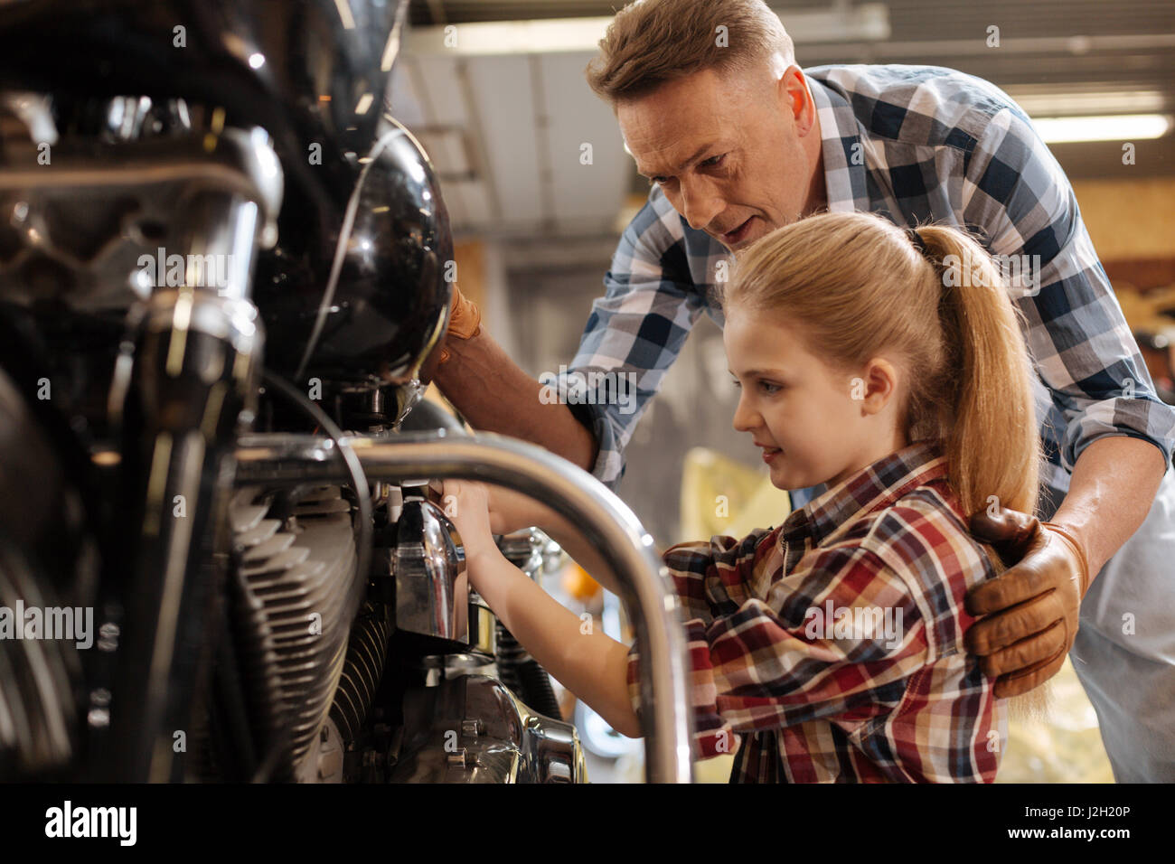 Dedicated cool dad teaching his child Stock Photo - Alamy