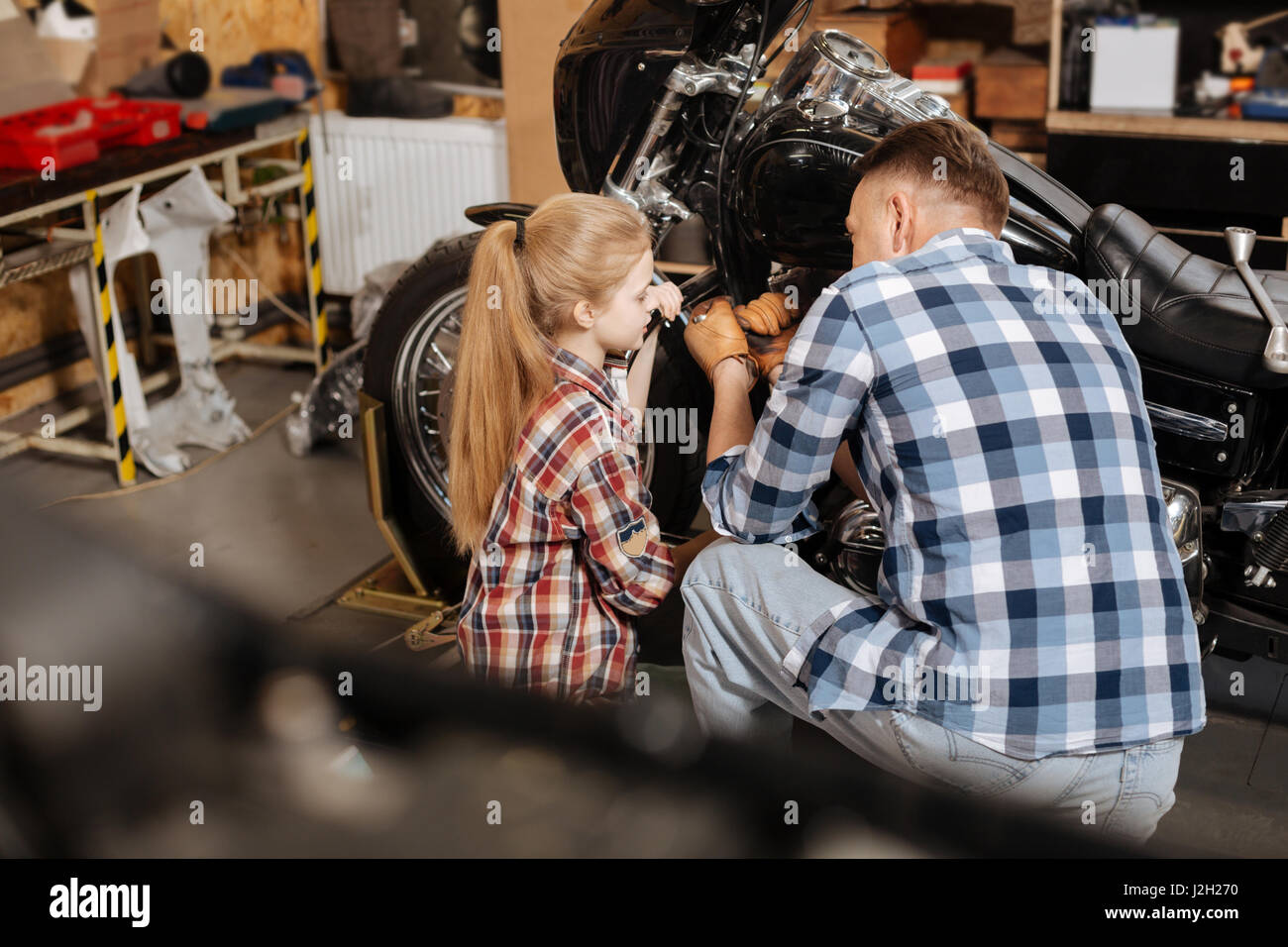 Adorable family fixing the engine together Stock Photo - Alamy
