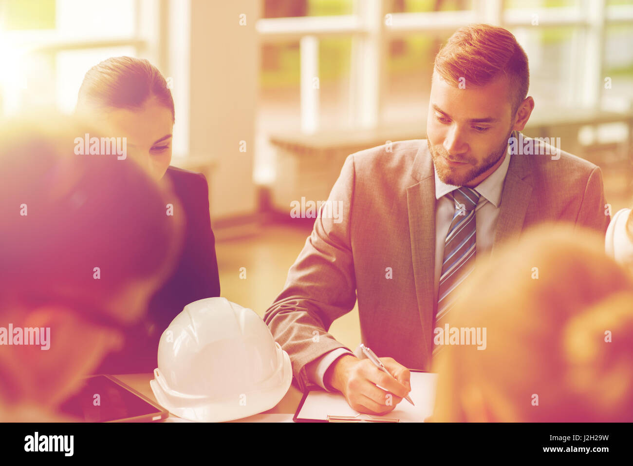 architects with helmet and clipboard at office Stock Photo - Alamy