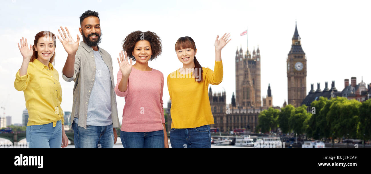 Woman waving at group of people hi-res stock photography and images - Alamy