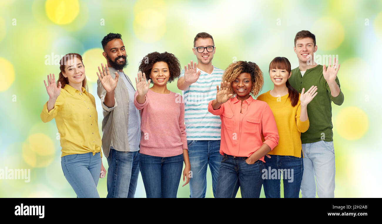 international group of happy people waving hand Stock Photo - Alamy