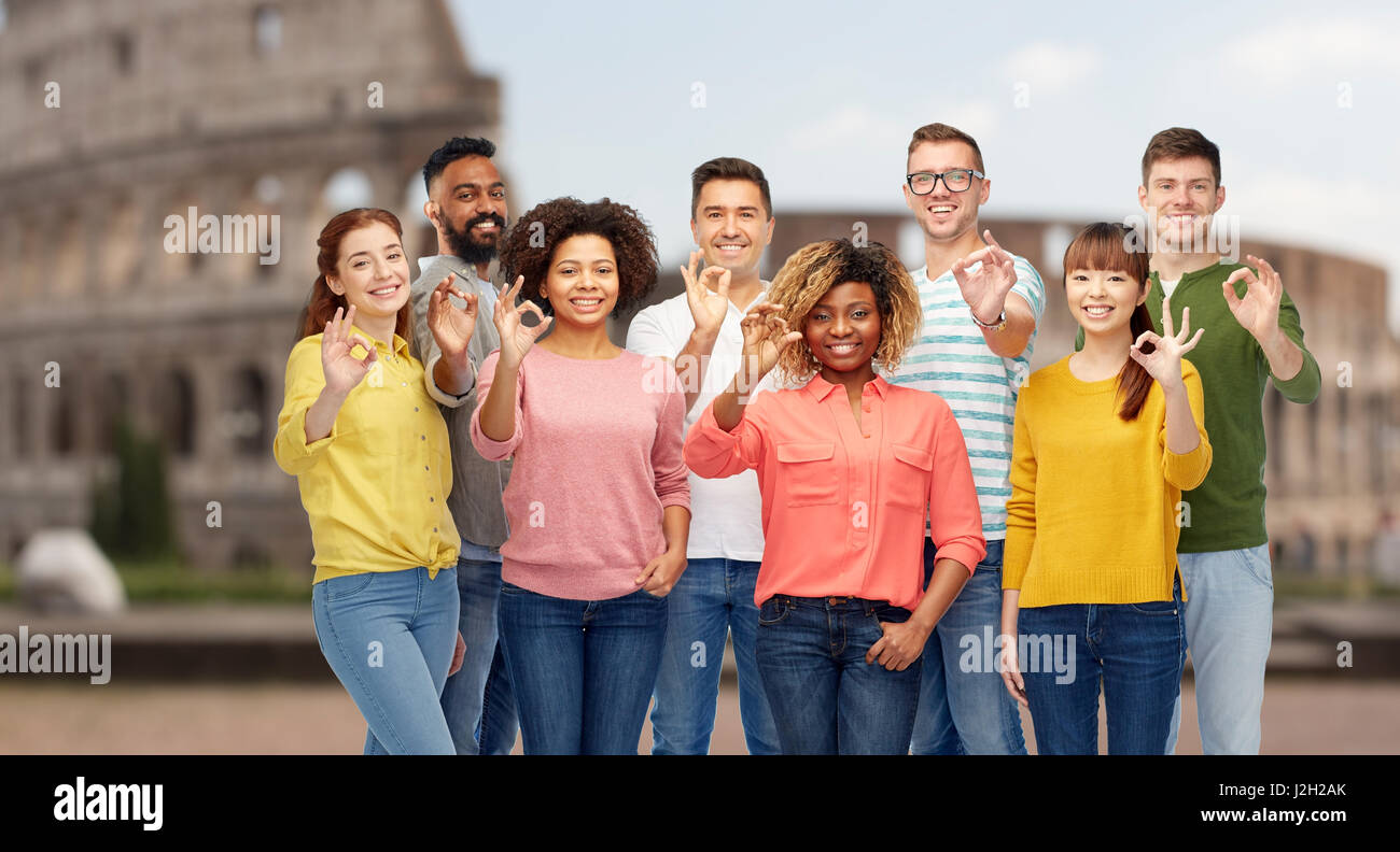 international people showing ok over coliseum Stock Photo - Alamy