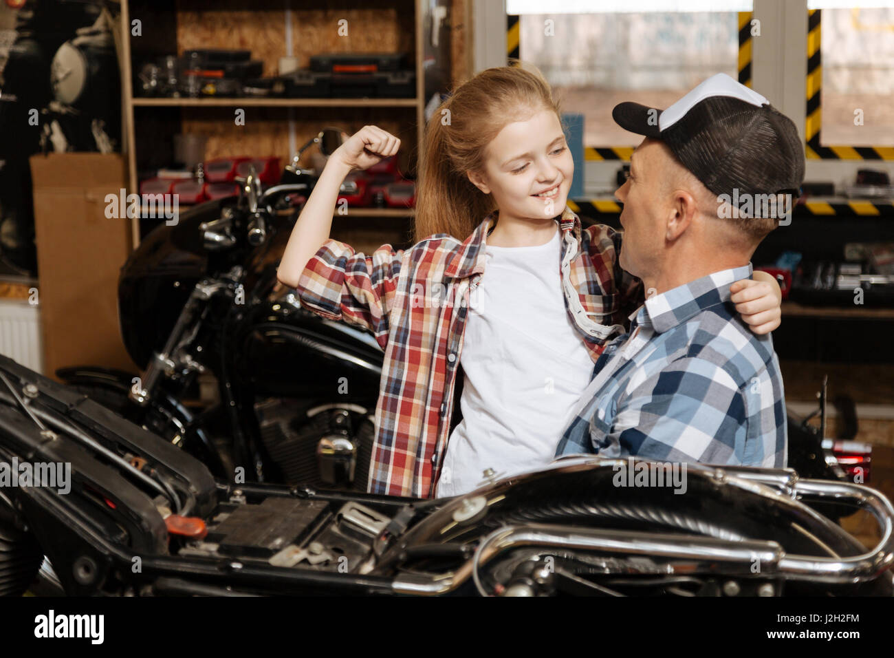 Cheerful sincere guy adoring his daughter Stock Photo - Alamy