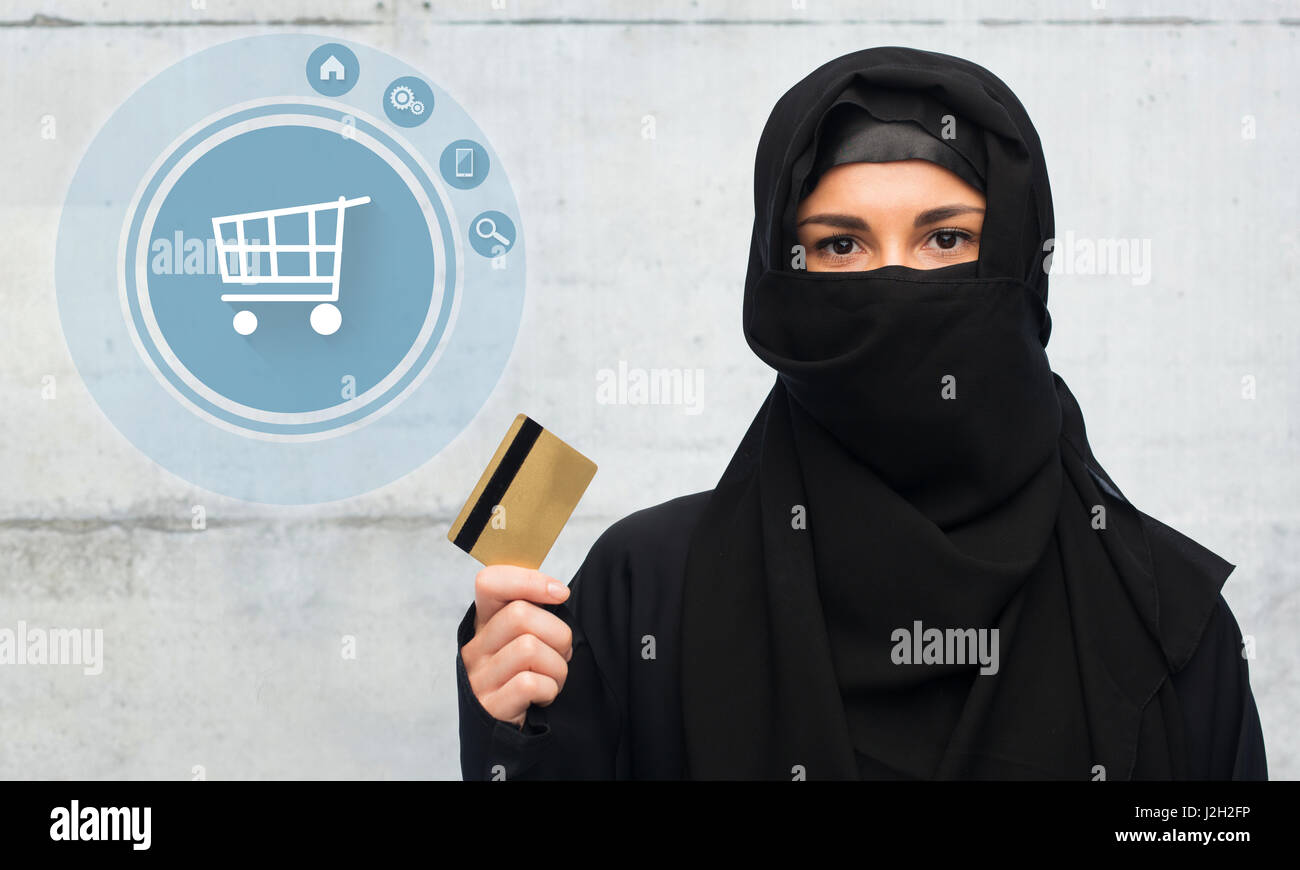 muslim woman in hijab with credit card over white Stock Photo - Alamy