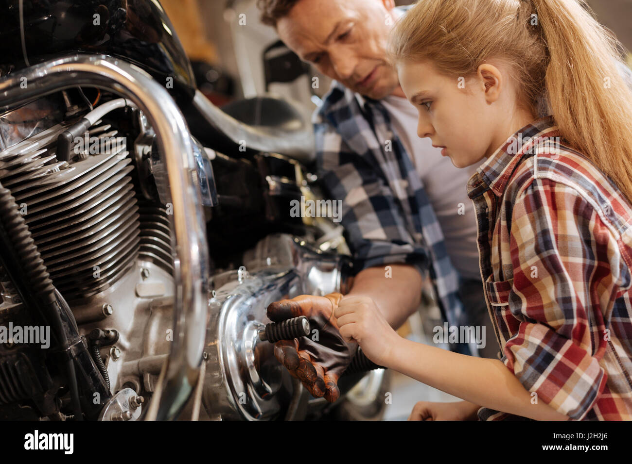 Attentive lovely dad trying protecting his child Stock Photo - Alamy