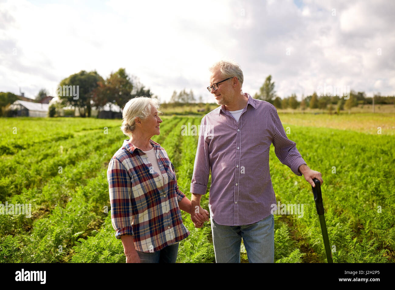 Happy mature farmer shovel hi-res stock photography and images - Alamy