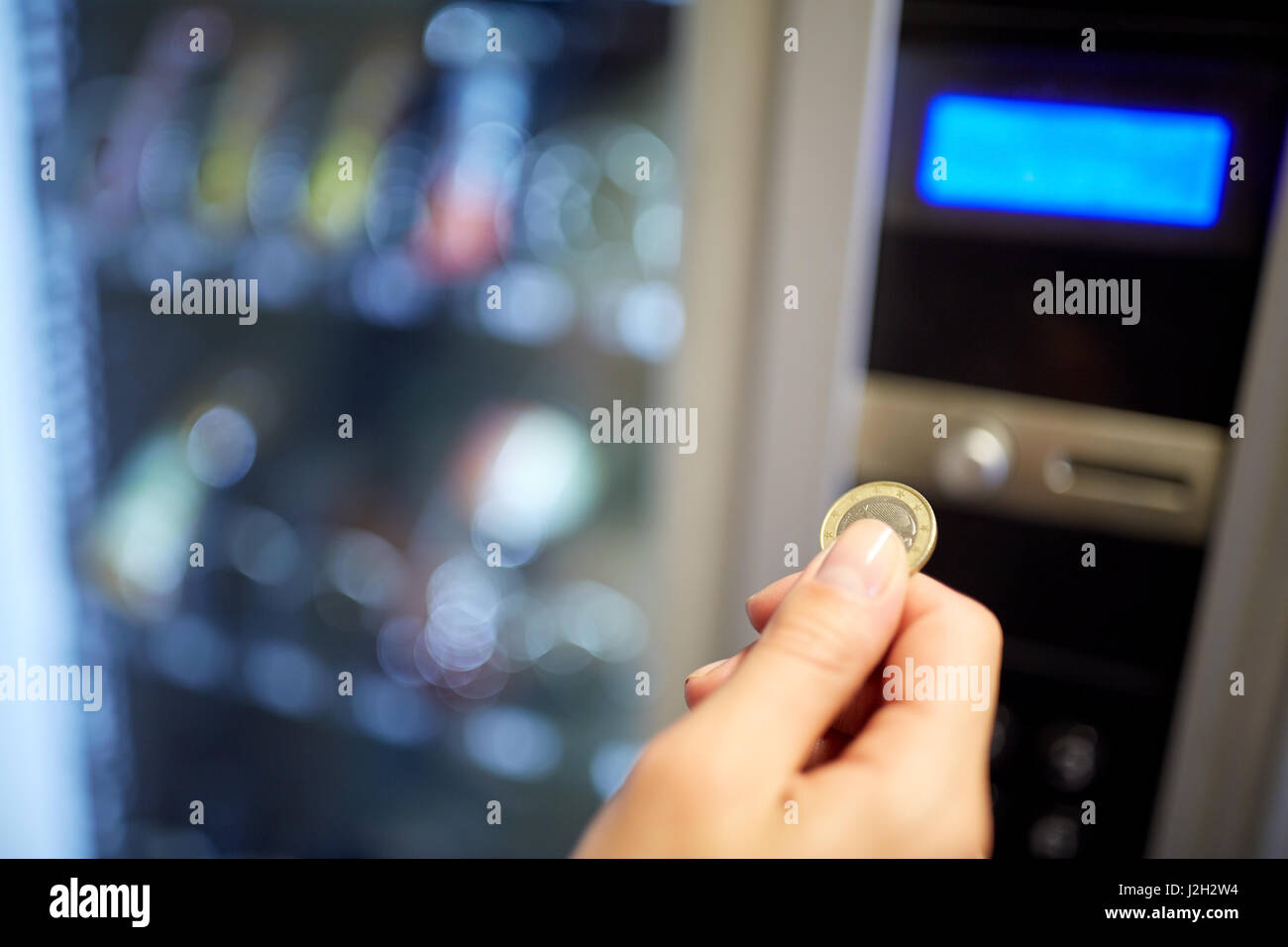 hand inserting euro coin to vending machine slot Stock Photo - Alamy