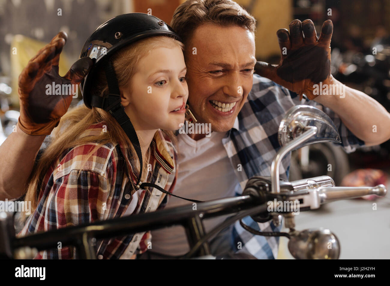 Active funny couple goofing around in garage Stock Photo - Alamy