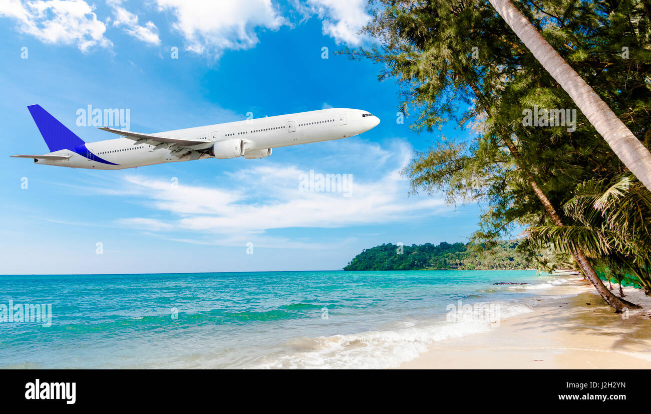 Plane fly over ocean Stock Photo - Alamy