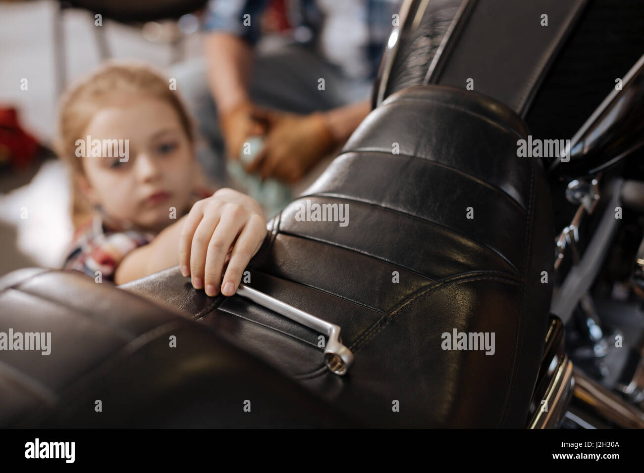 Adorable focused little professional grabbing a wretch Stock Photo - Alamy