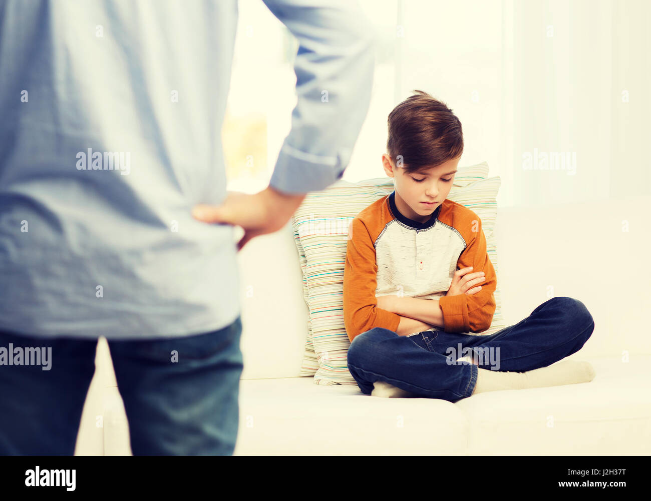 upset or feeling guilty boy and father at home Stock Photo - Alamy