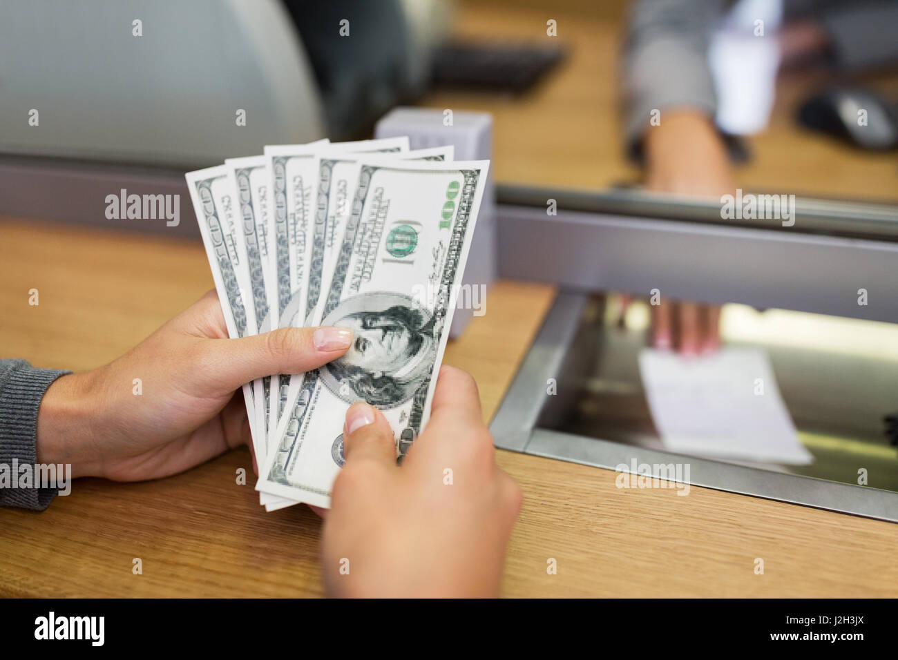 hands with money at bank office or exchanger Stock Photo - Alamy