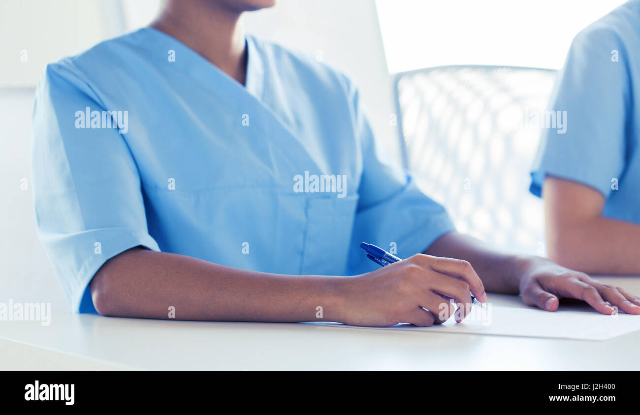 Healthcare professional taking notes hi-res stock photography and ...