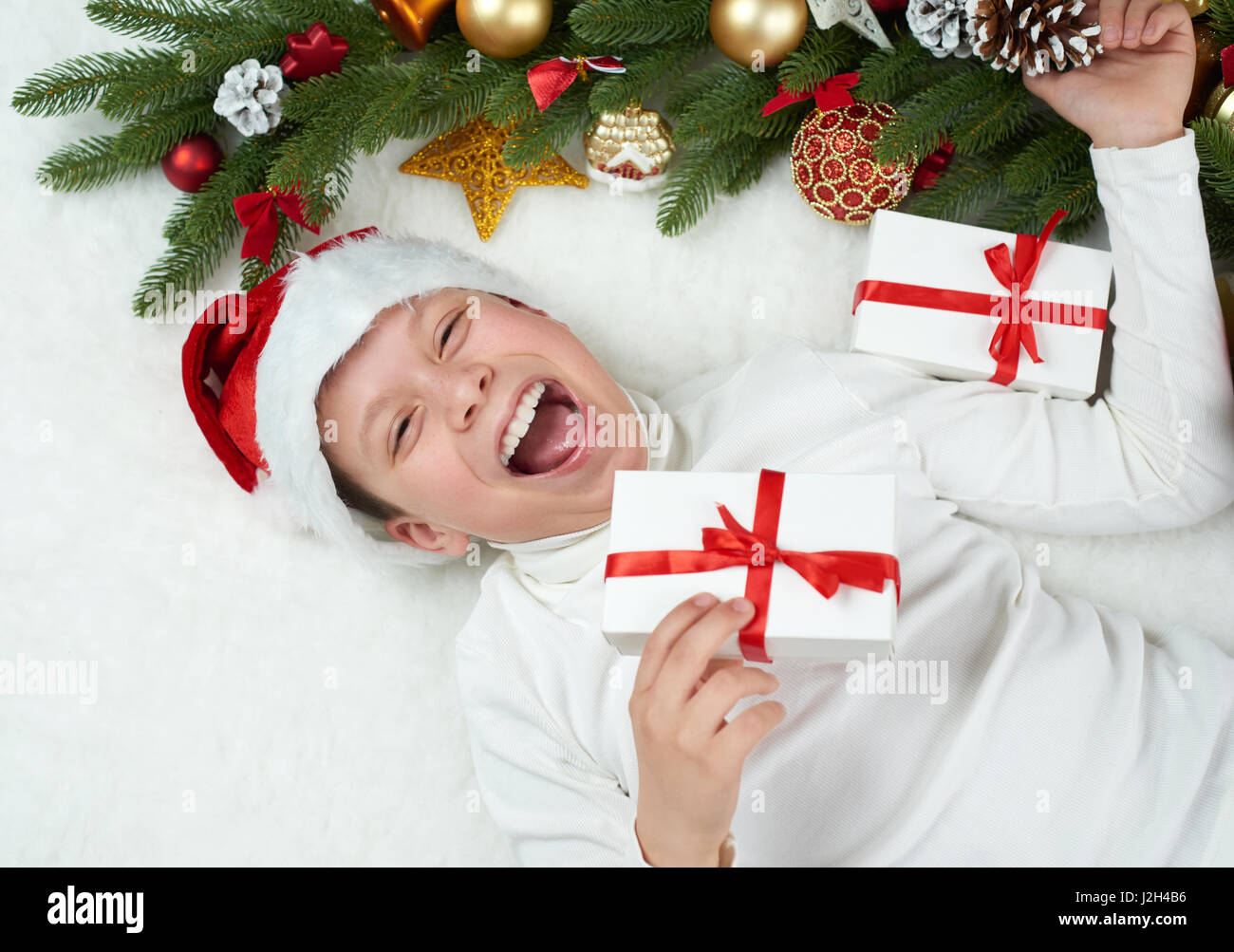 boy child having fun with christmas decoration, face expression and ...