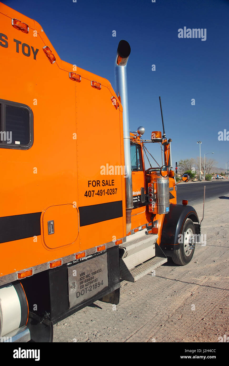Orange Kenworth Truck parked by the side of the highway in Nevada, USA ...