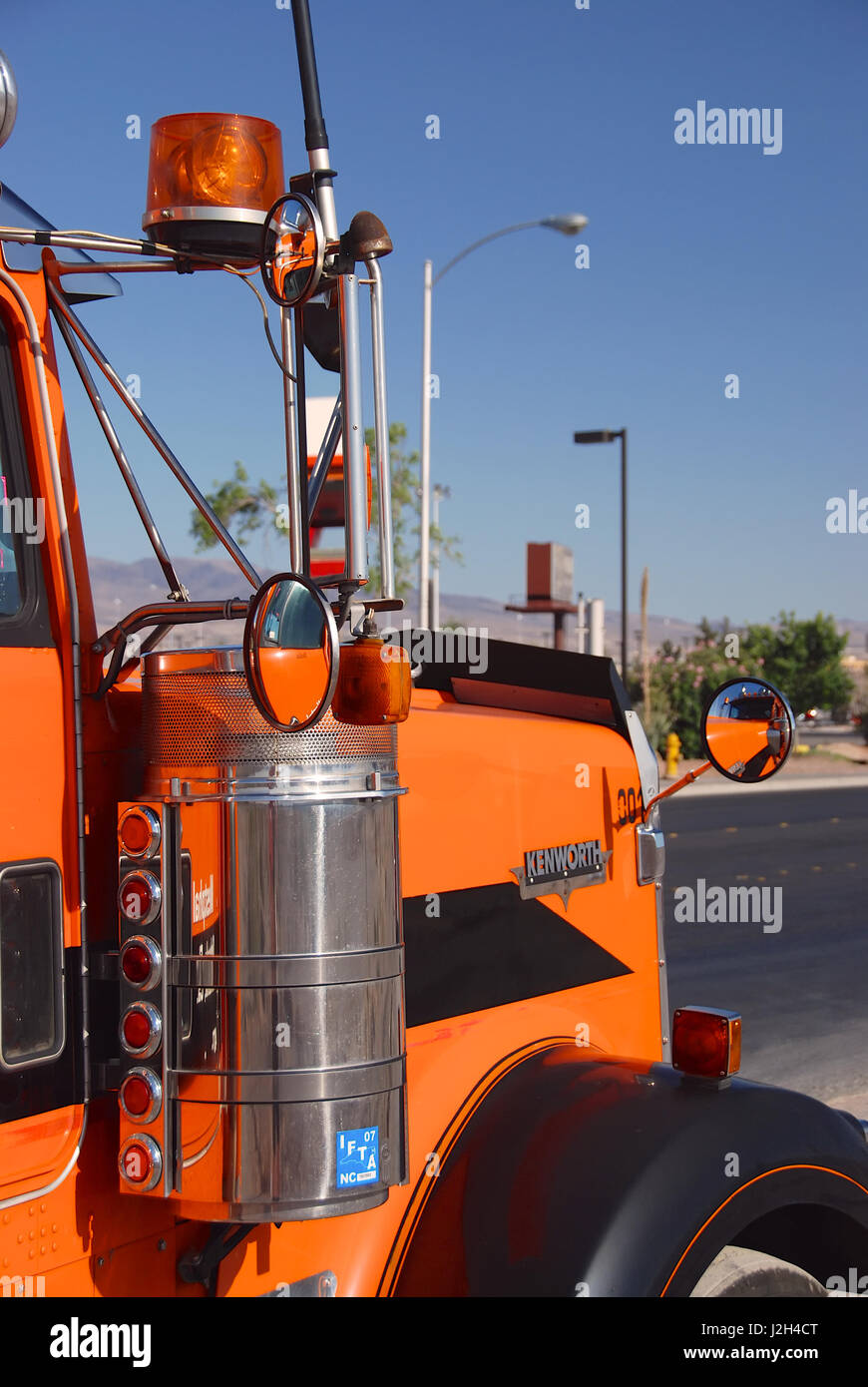 Orange Kenworth Truck parked by the side of the highway in Nevada, USA ...
