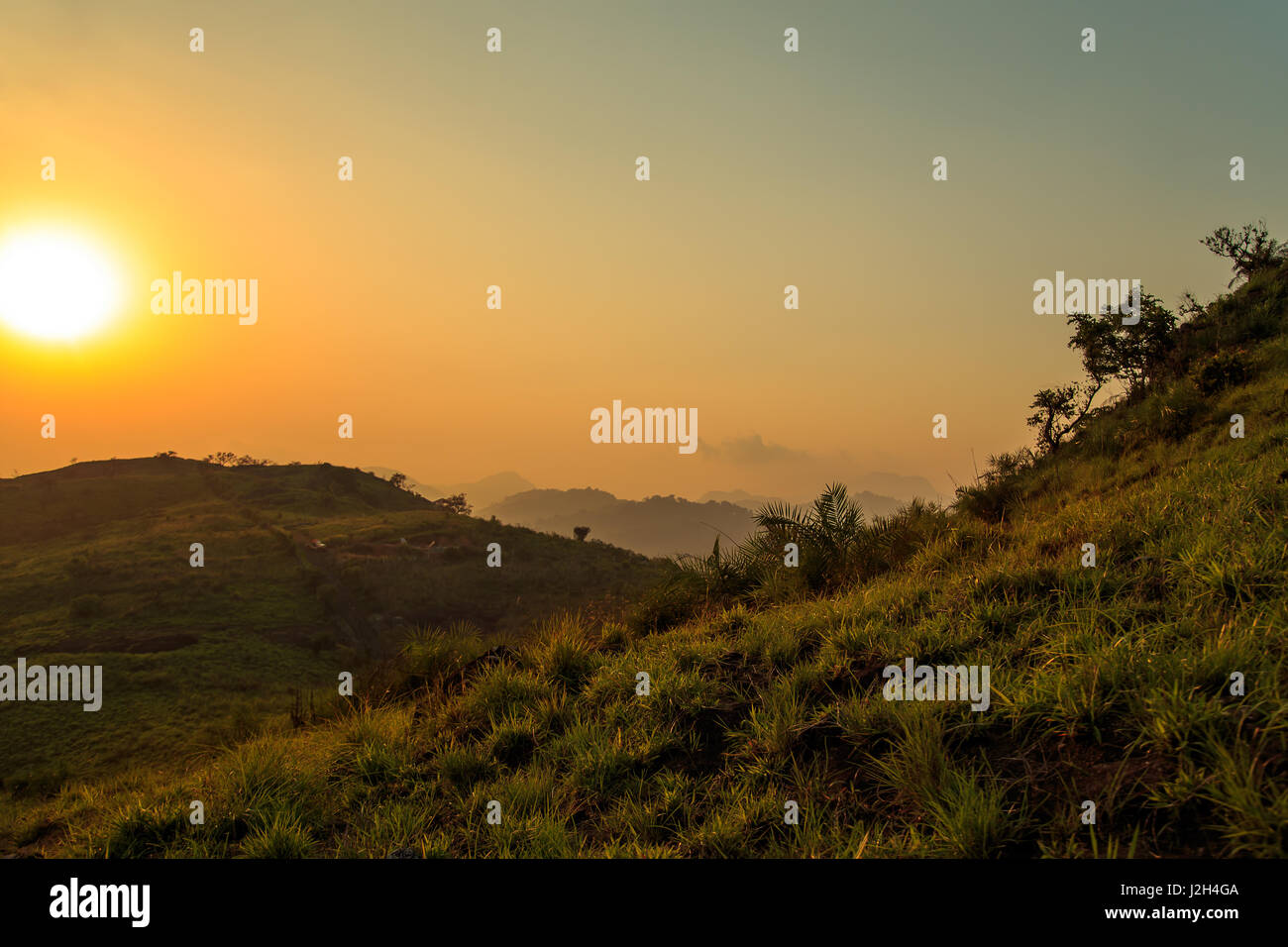 Beautiful sunset in the mountains. Munnar, Kerala state, South India ...