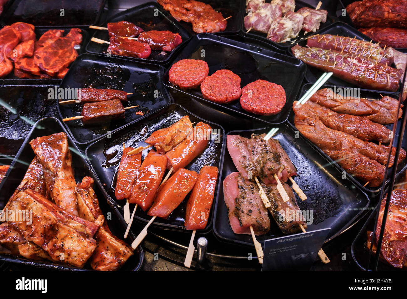 Marinaded meat for grilling in a counter display in a supermarket. meat ...