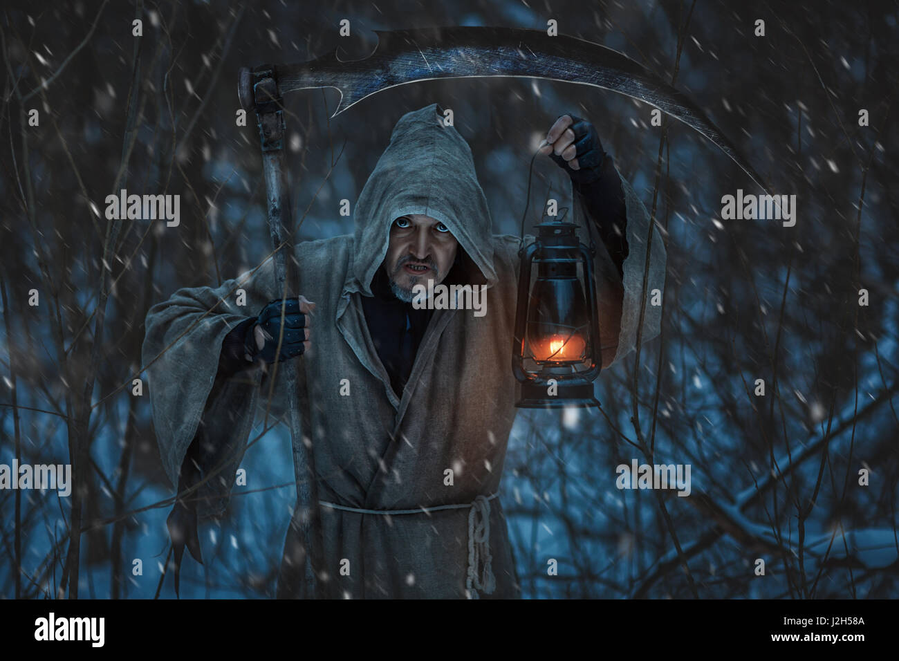 Close-up portrait of a grim reaper with a scythe causing horror and ...