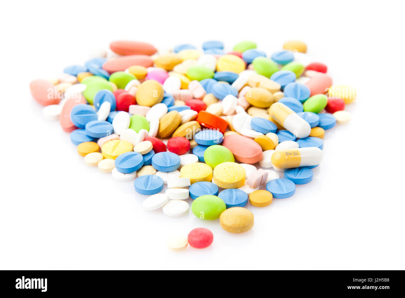Pile of various colorful pills isolated on white Stock Photo - Alamy