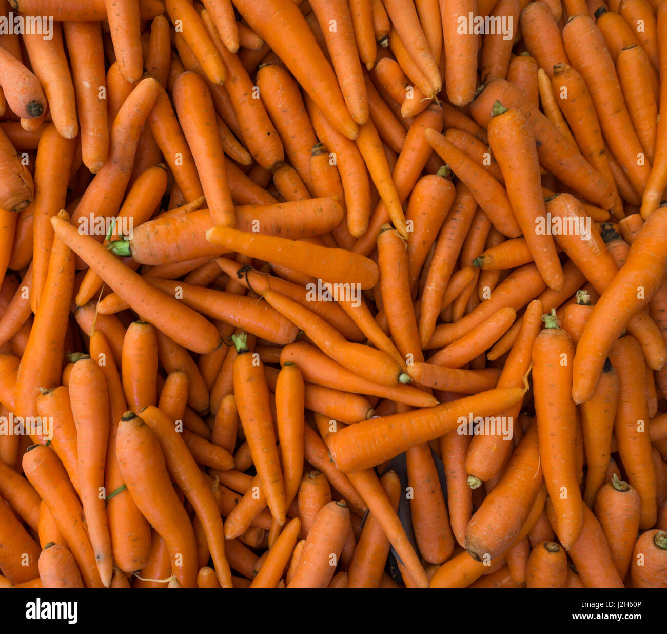 carrot background. Raw fresh carrots close up Stock Photo - Alamy