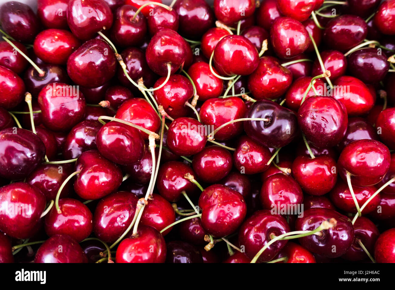sweet red cherry background. Cherry selection Stock Photo - Alamy