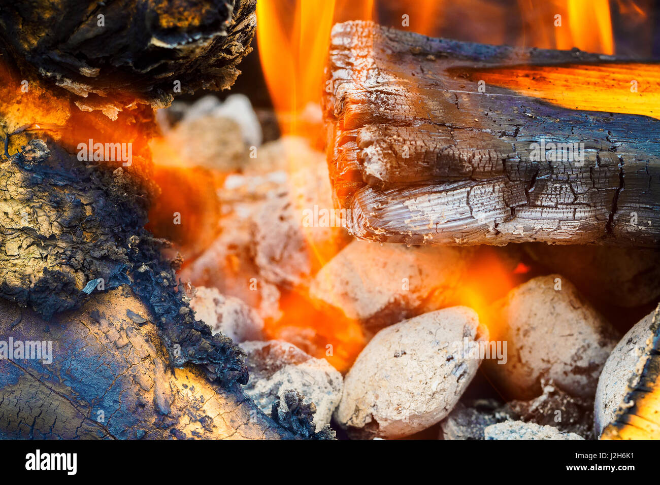 coal and fire flame burning charcoal in the background Stock Photo - Alamy
