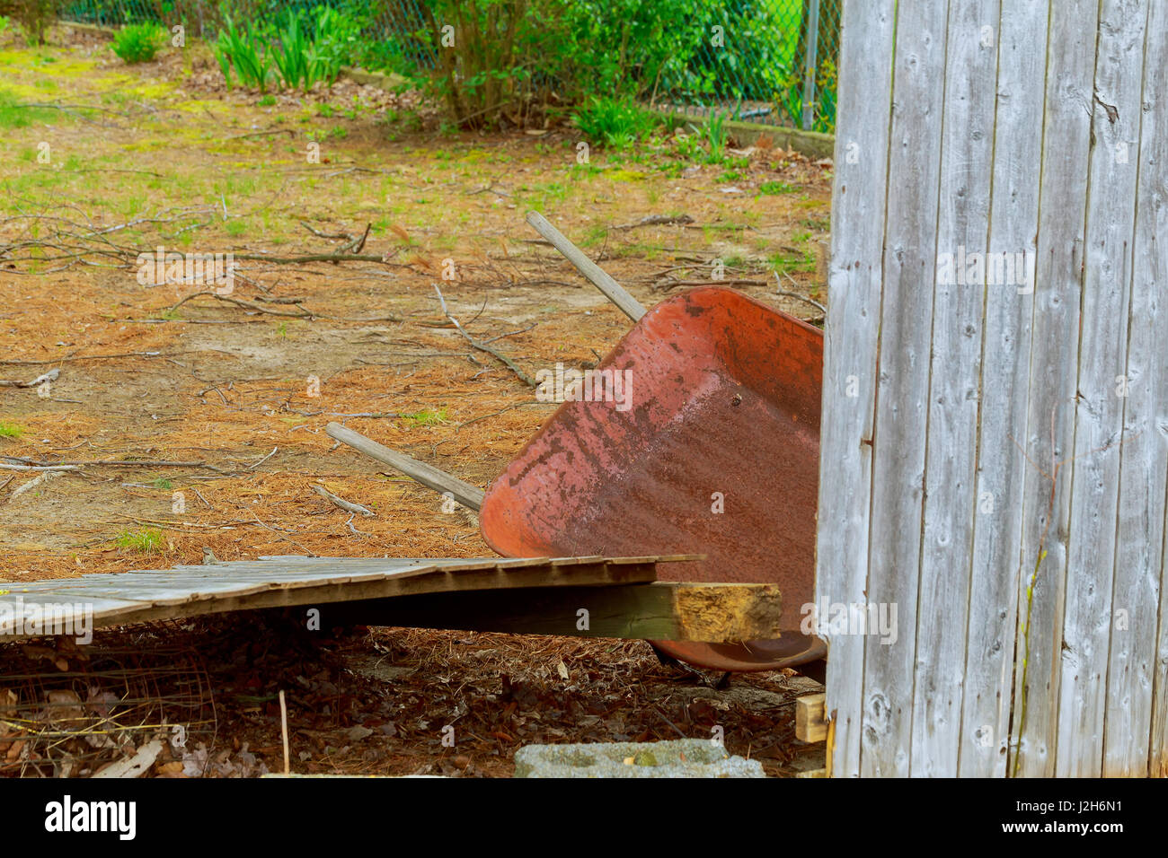 Metal empty wheelbarrow ready for good use empty Stock Photo - Alamy