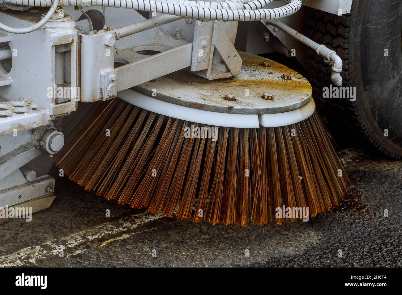 Close up road sweeper machine cleaning city street Cleaning streets ...