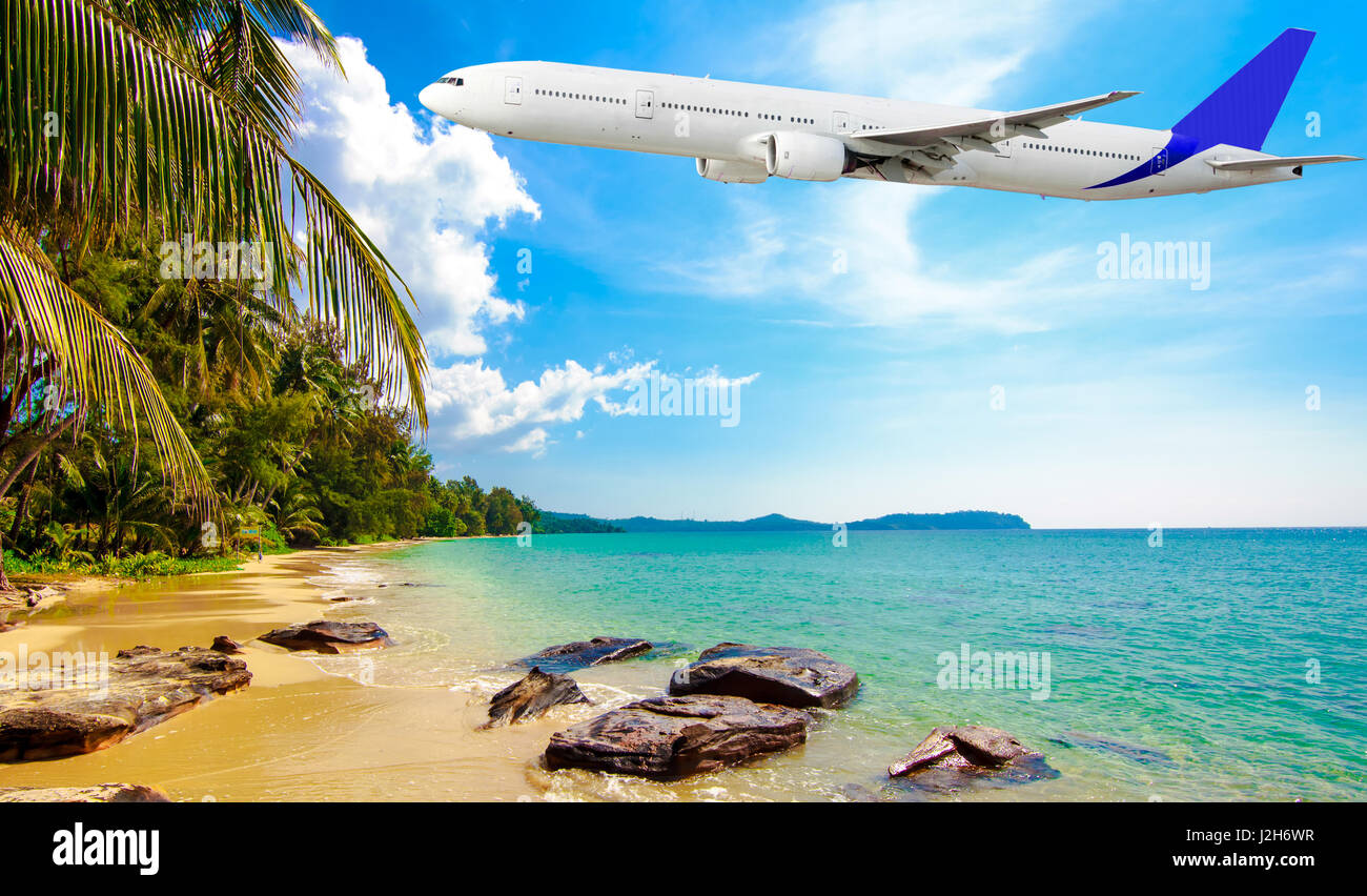Jet plane over the tropical sea Stock Photo - Alamy