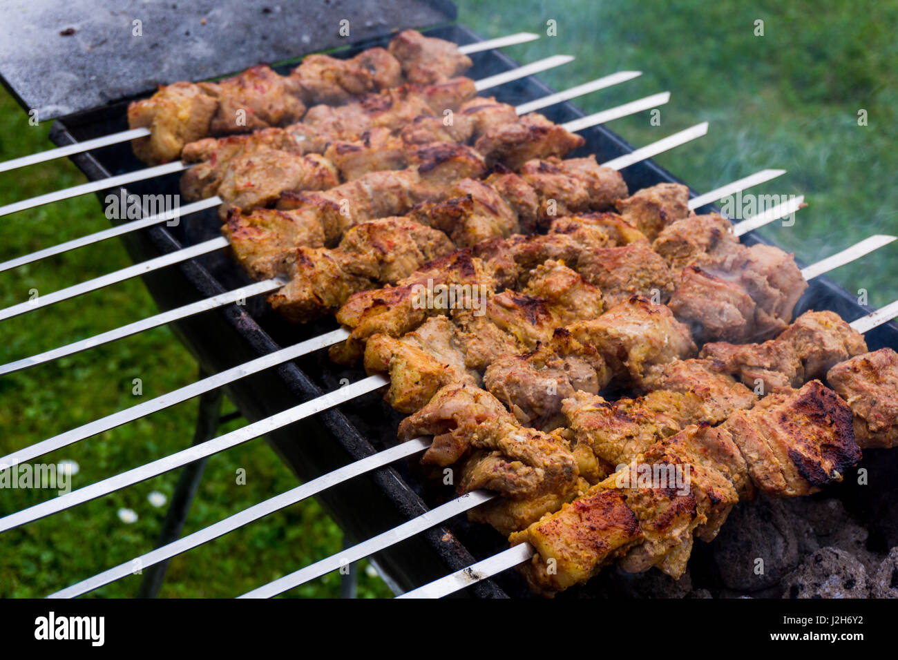 Grilled marinated caucasus barbecue meat shashlik Stock Photo - Alamy