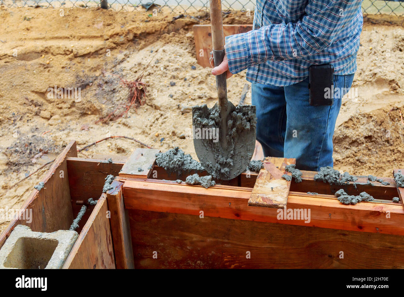 Man with barrow full of ground, work in garden Stock Photo - Alamy