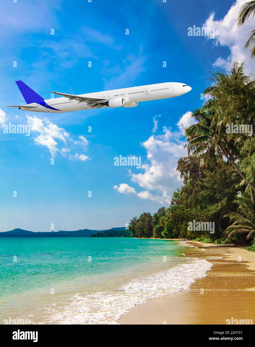 Plane fly over ocean Stock Photo - Alamy