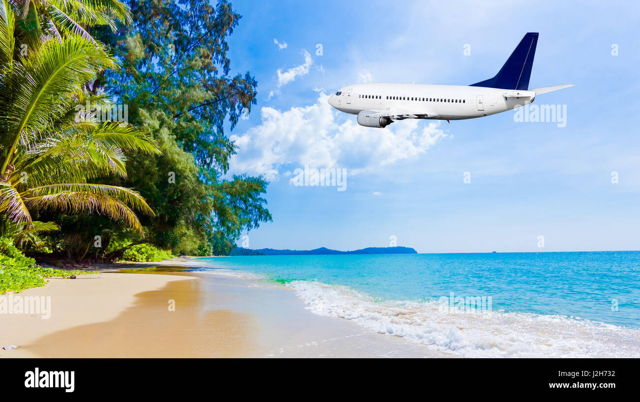 Plane fly over ocean Stock Photo - Alamy