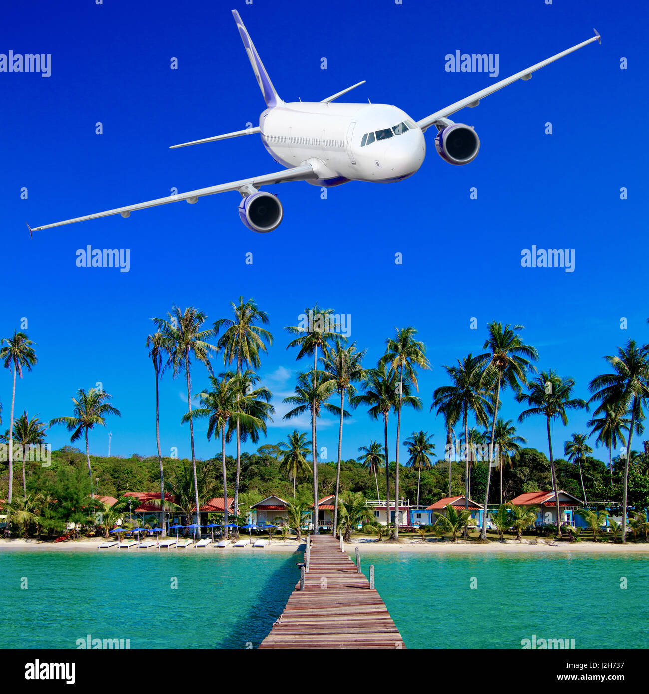 Plane fly over ocean Stock Photo - Alamy