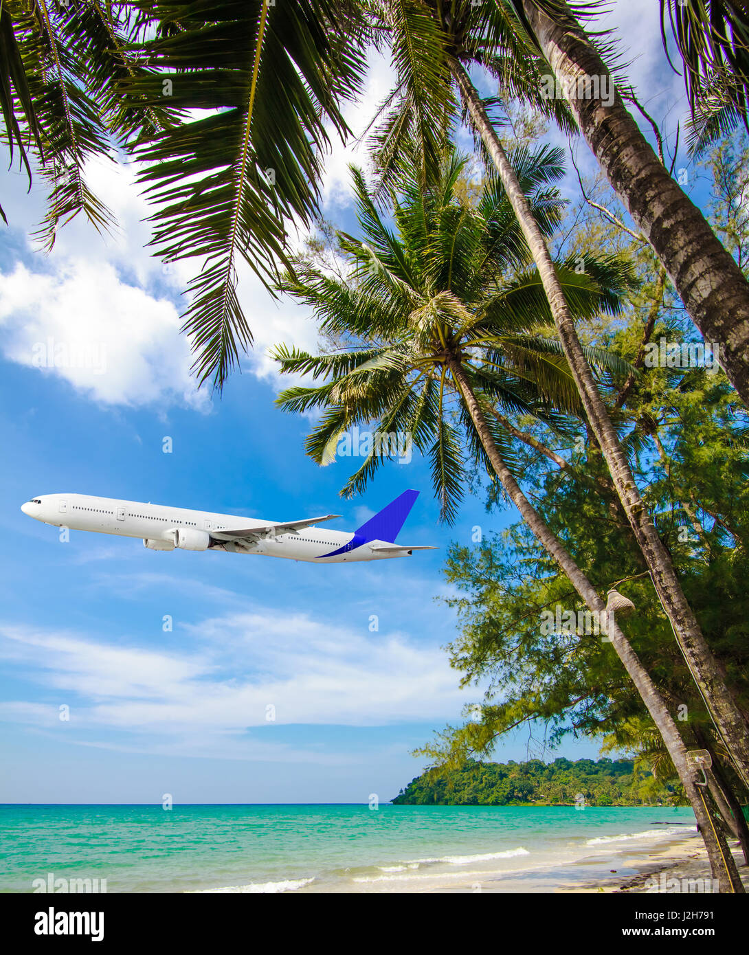 Plane fly over ocean Stock Photo - Alamy