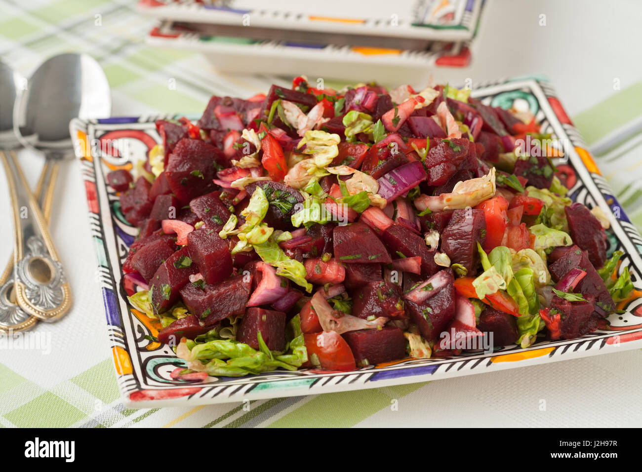 Modern designed dish with Moroccan beet salad close up Stock Photo - Alamy