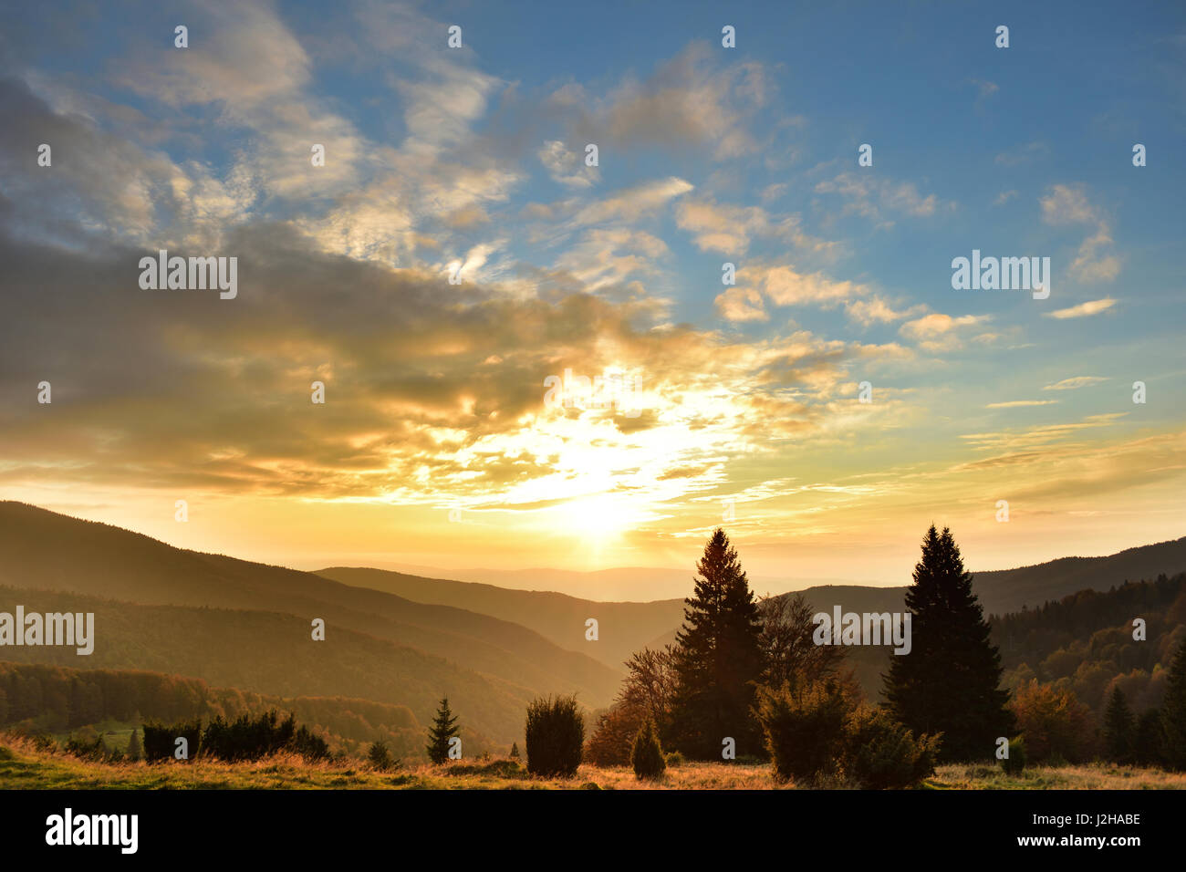 Colorful sunset in the mountain Stock Photo - Alamy