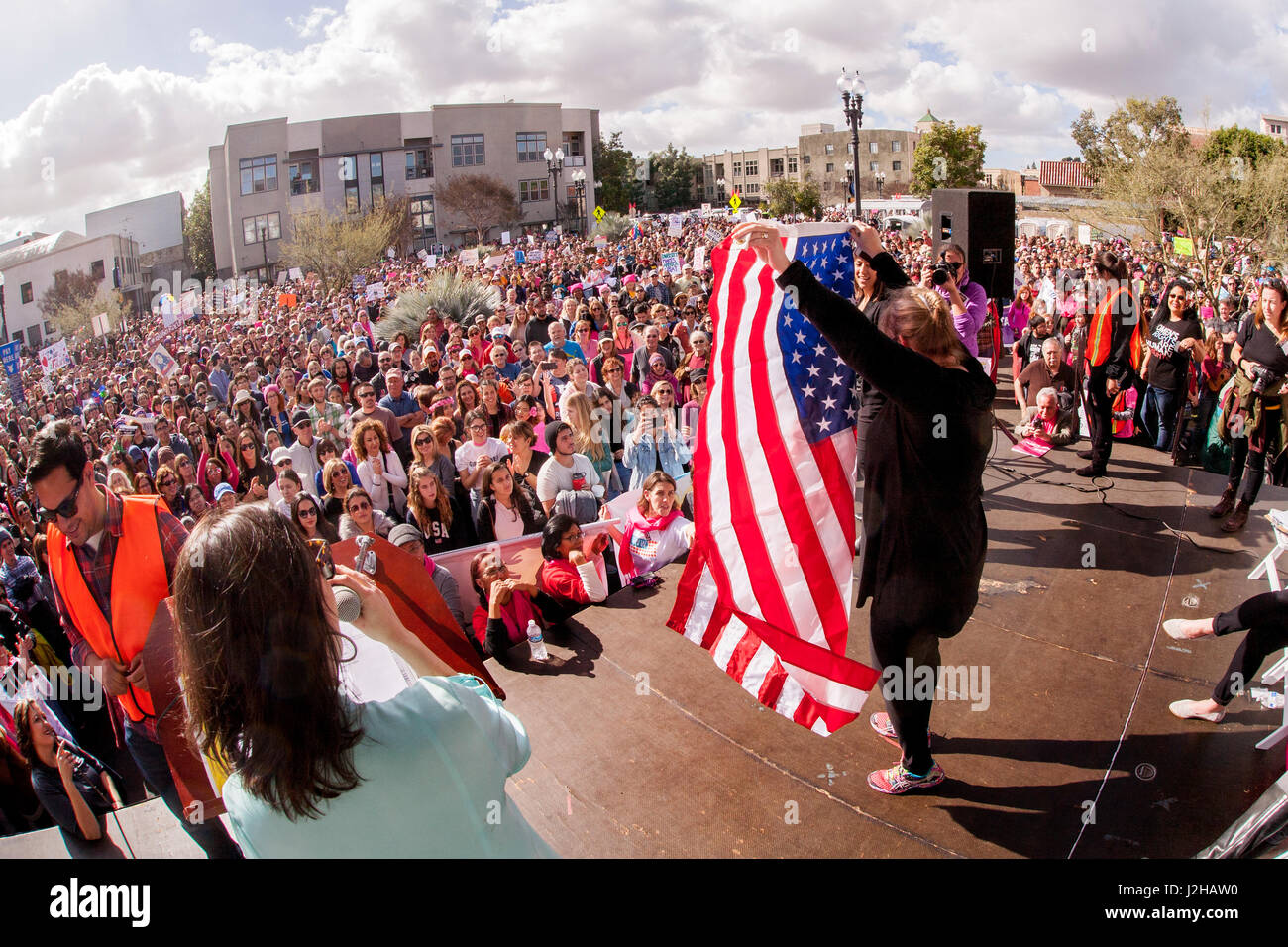 Walking marching crowd flag building exterior hi-res stock photography ...