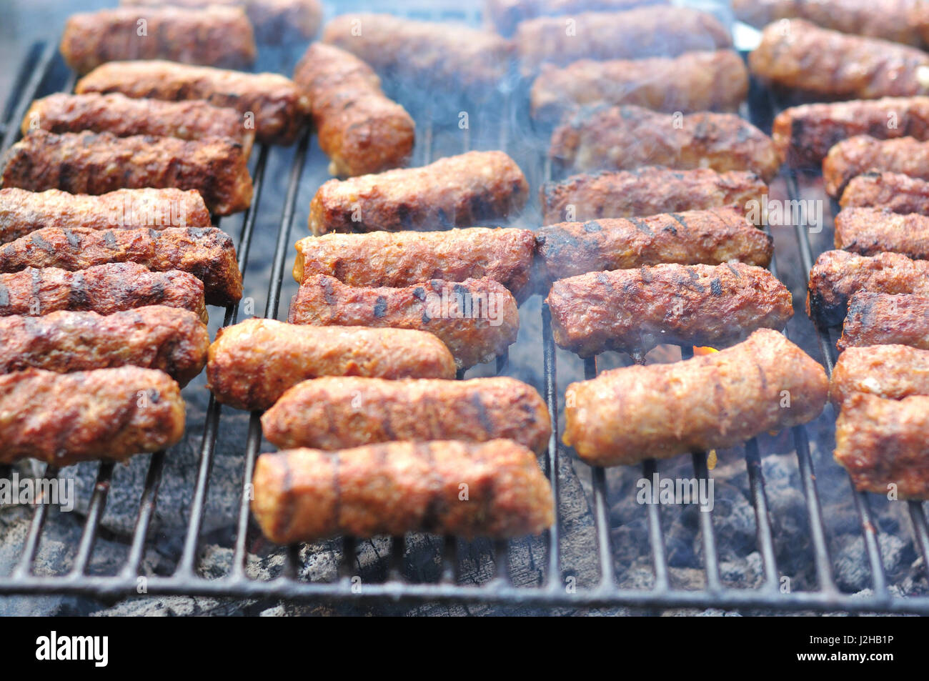 Traditional Romanian food, grilled meat rolls known as mititei Stock ...