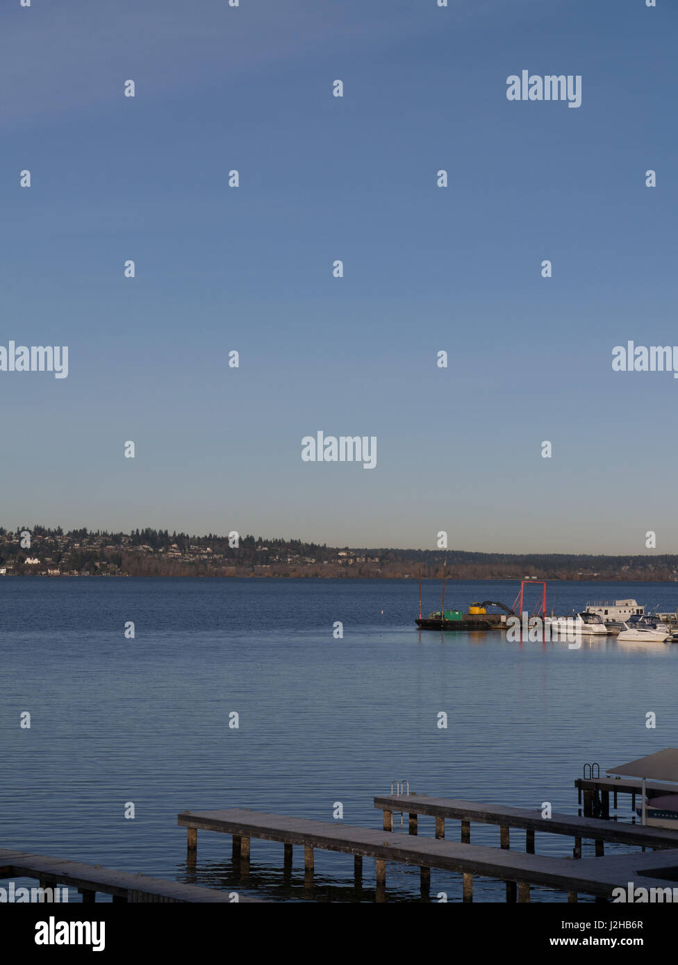 Lake scene with docks, boats portrait orientation Stock Photo - Alamy