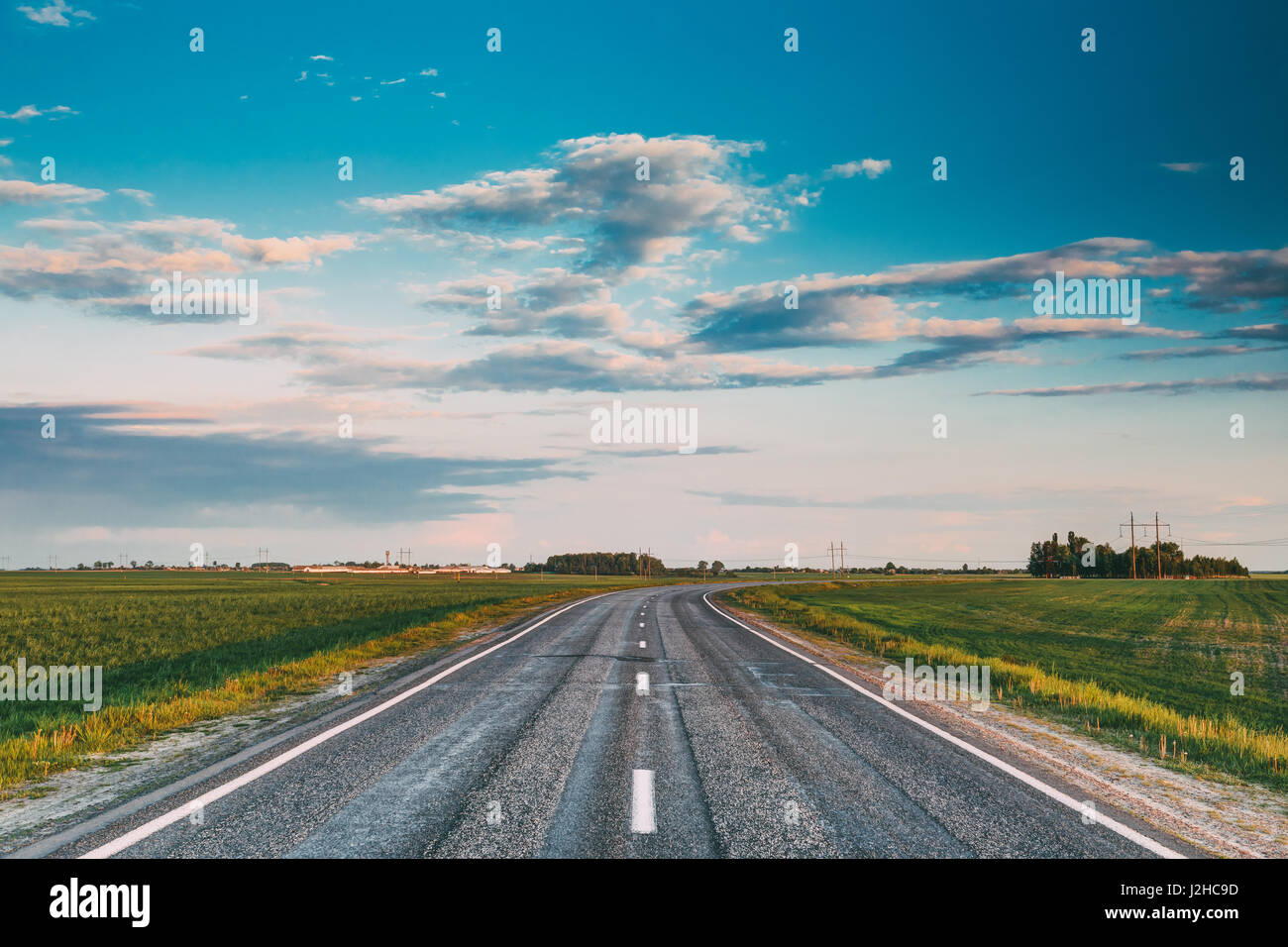 Curved Asphalt Country Open Road Through Spring Fields And Meadows In ...